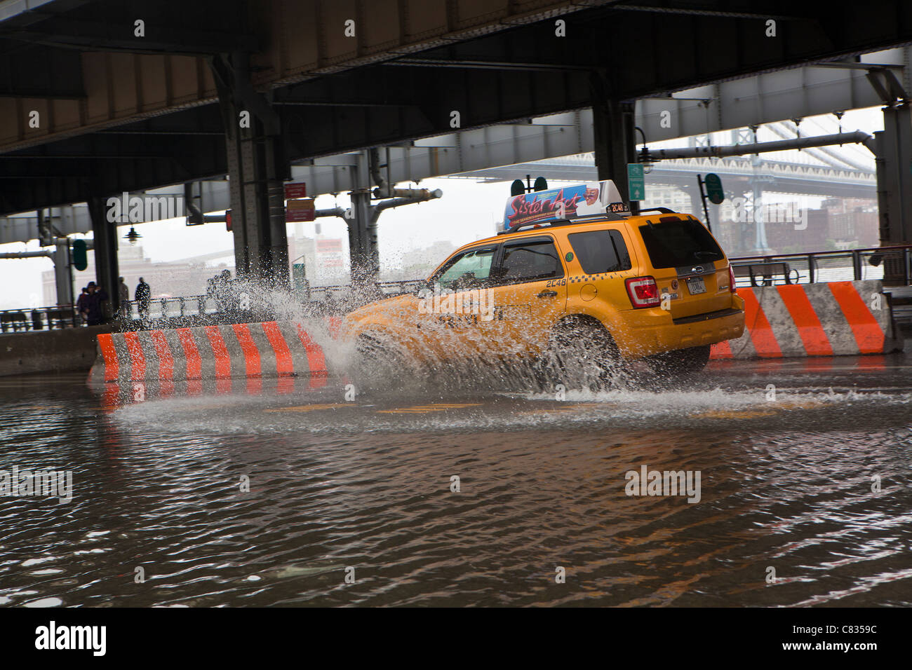 Flooded street under Manhattan Bridge in NYC, during Hurricane Irene ...