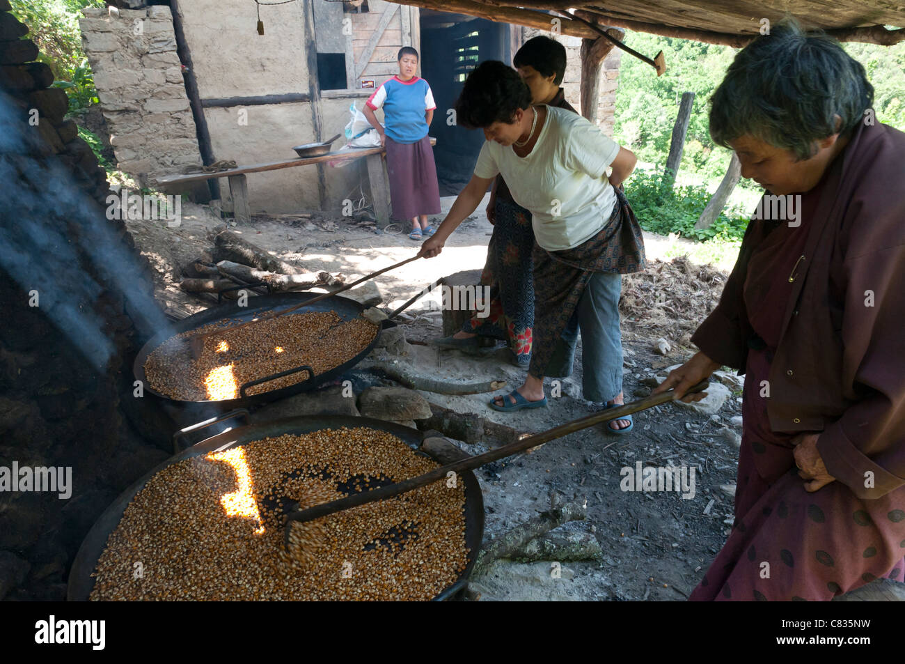 female farmers preparing tengma a maize snack. Mongar. Bhutan Stock ...