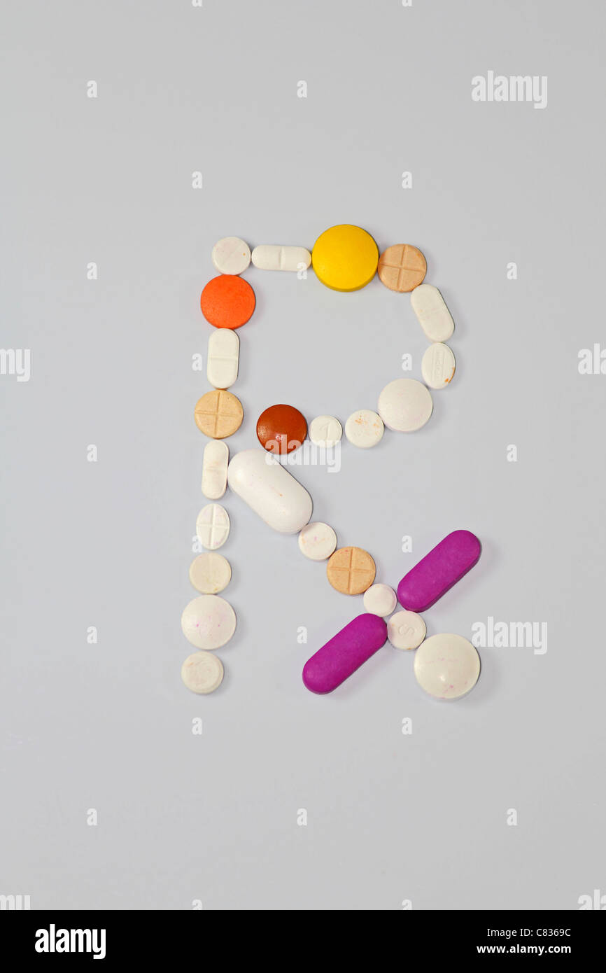 Pills arranged in Rx symbol Stock Photo - Alamy
