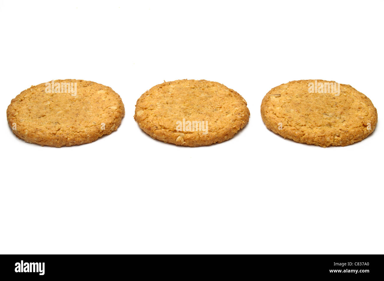 Three cookies in a row isolated on white Stock Photo - Alamy
