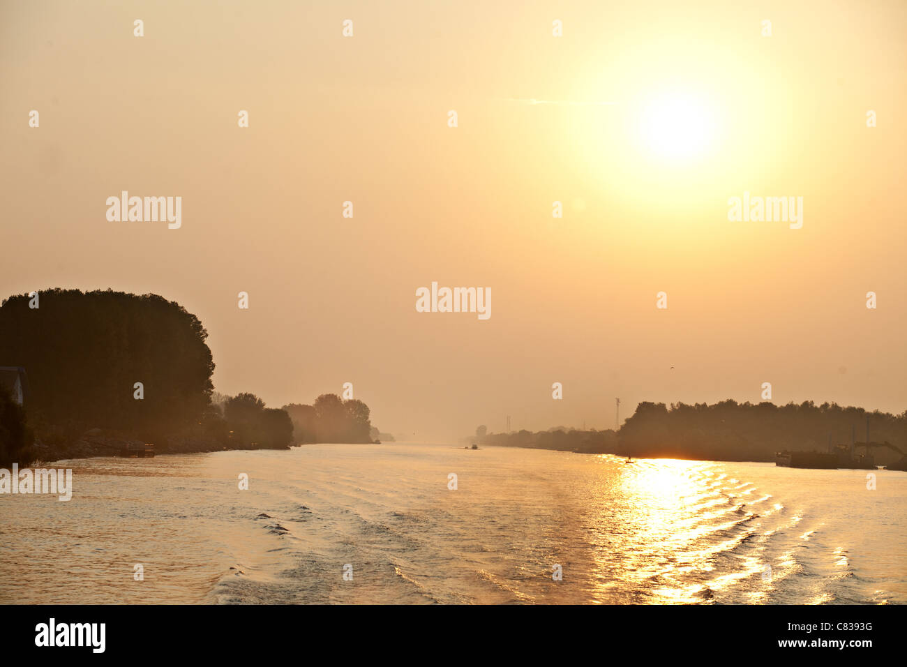 Sunrise over Sulina channel branch of Danube Delta, Romania Stock Photo ...