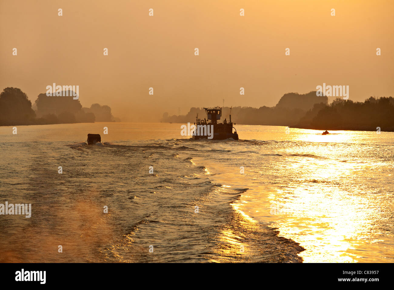 Sunrise over Sulina channel branch of Danube Delta, Romania Stock Photo ...