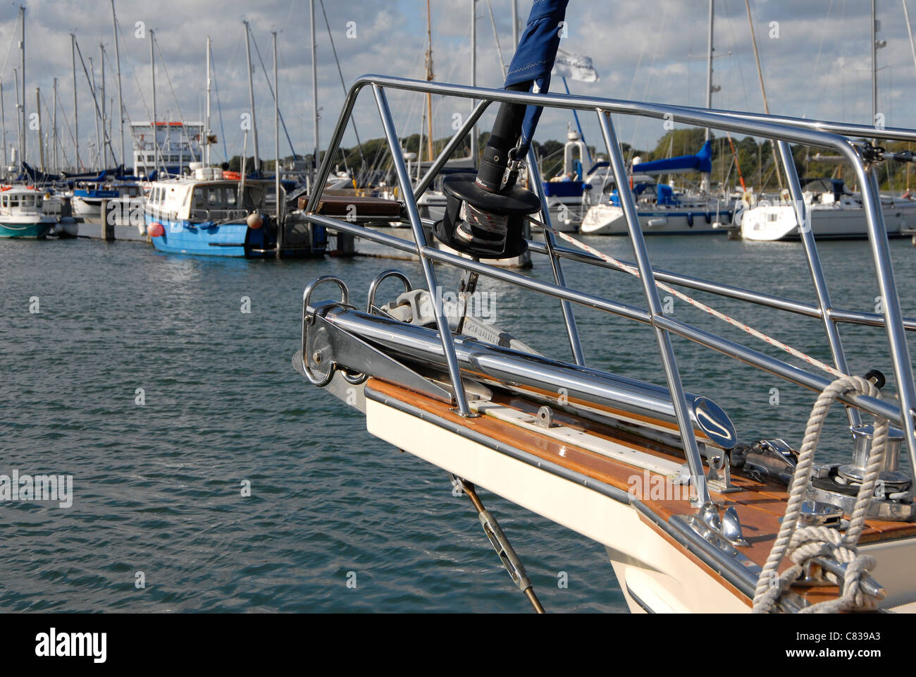 Yacht bowsprit with marina background Stock Photo - Alamy