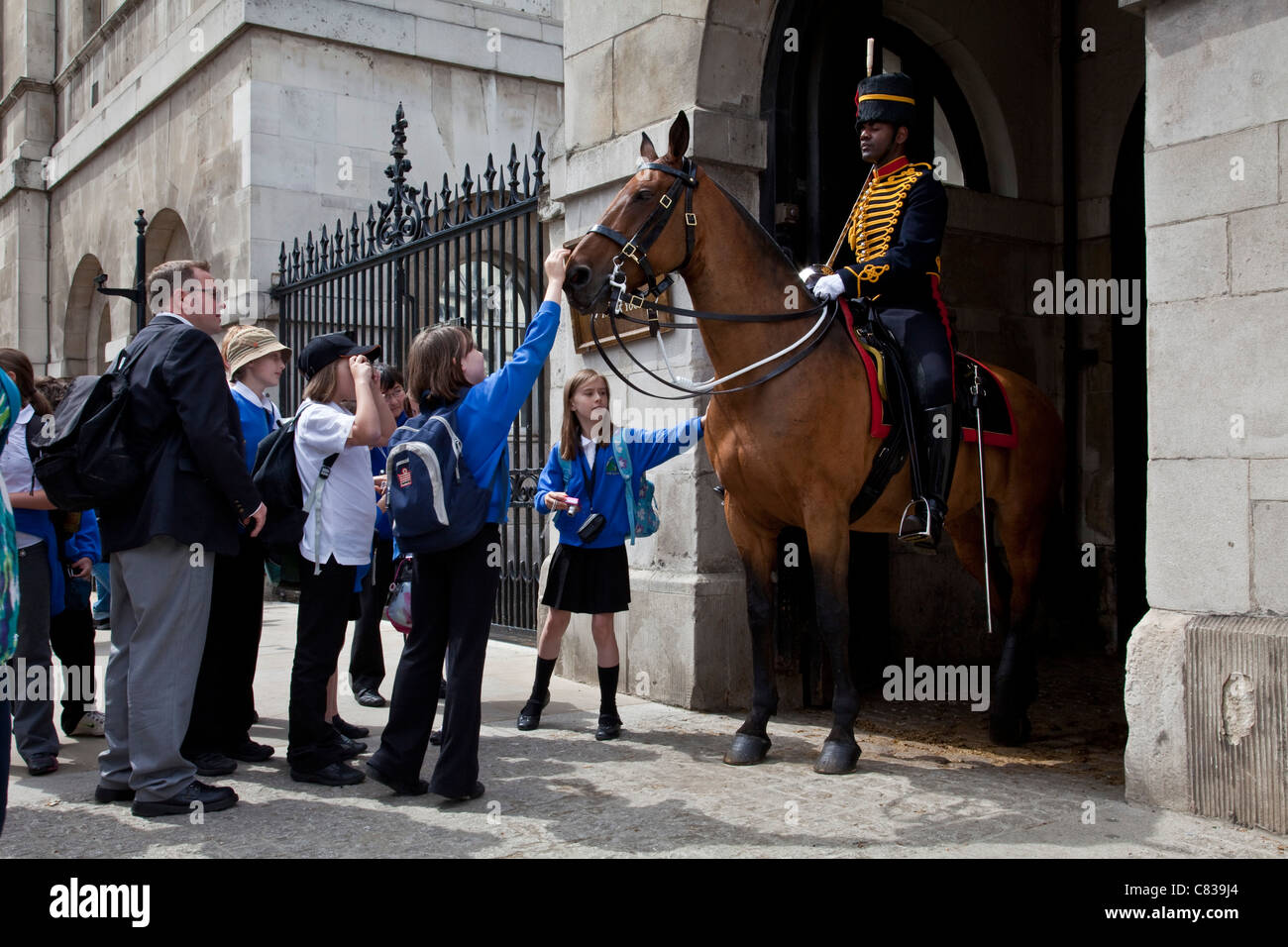 British Schoolchildren pose for photographs with a soldier from the ...