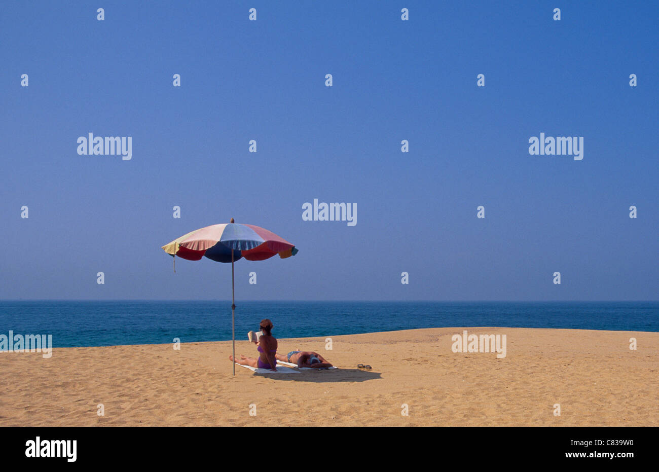 Lone Parasol at Surya Samudra Beach Stock Photo - Alamy