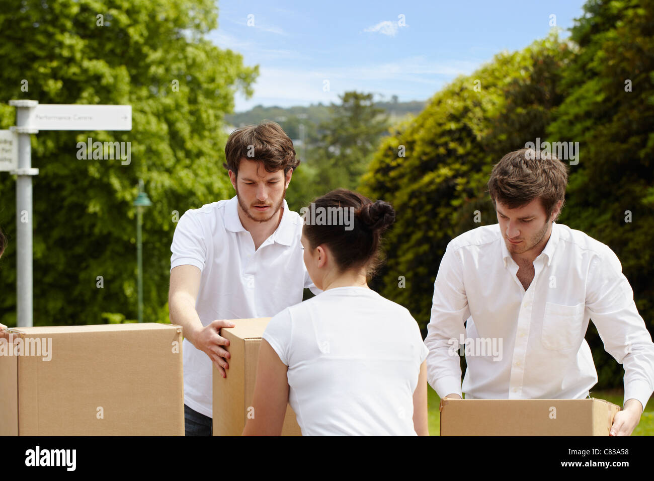 People stacking cardboard boxes Stock Photo - Alamy
