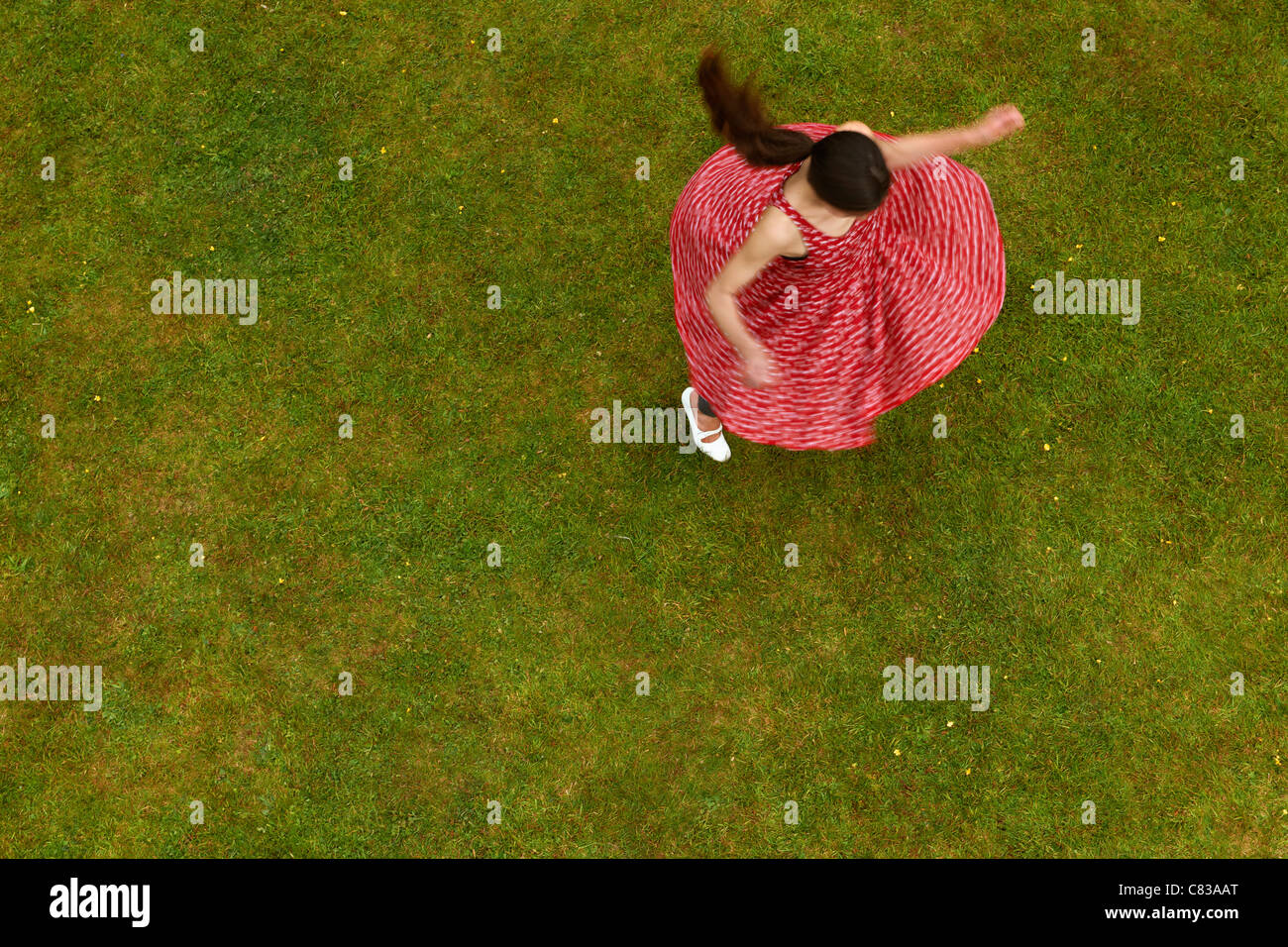 Woman spinning outdoors Stock Photo - Alamy