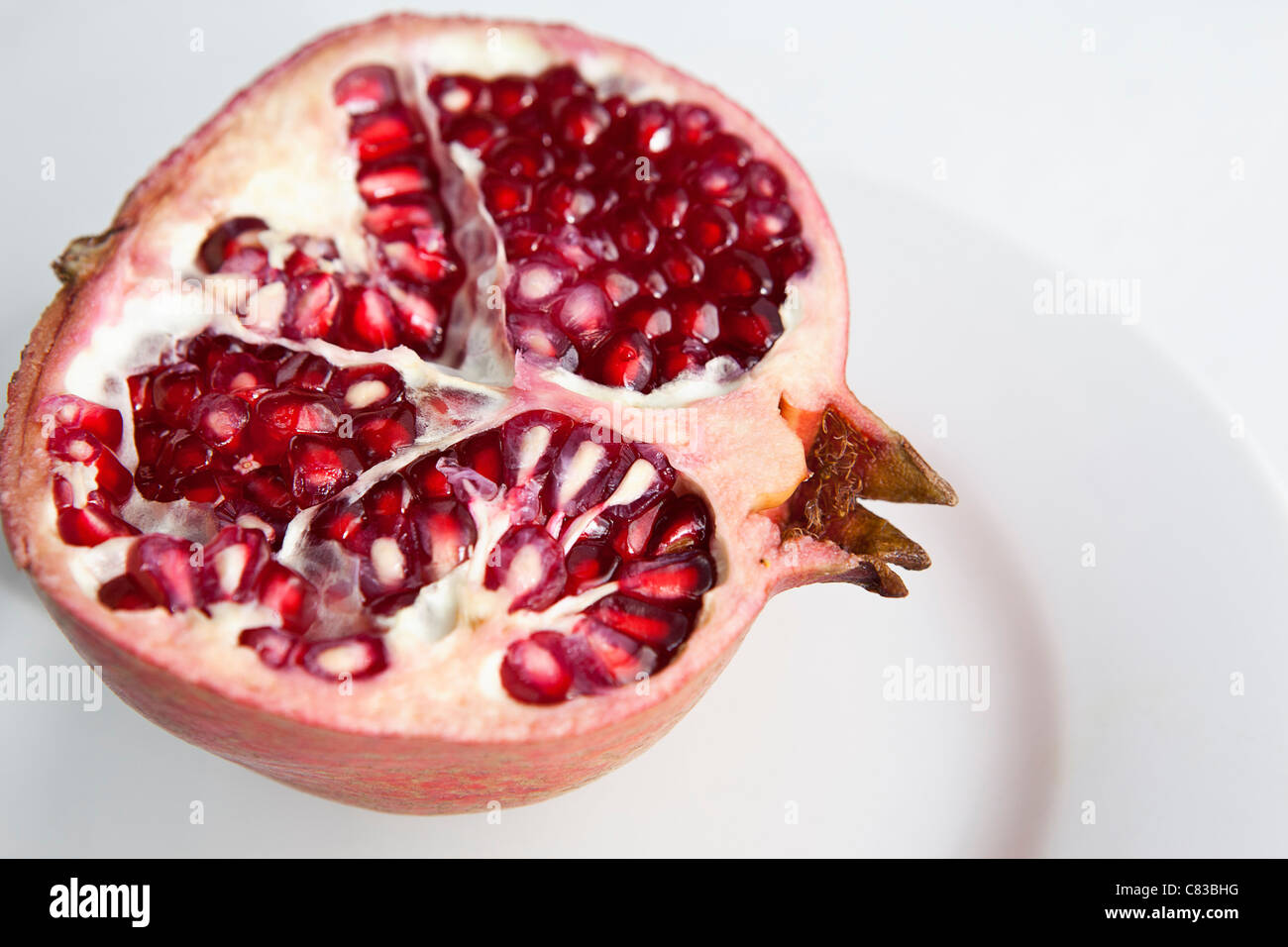 Half pomegranate hi-res stock photography and images - Alamy