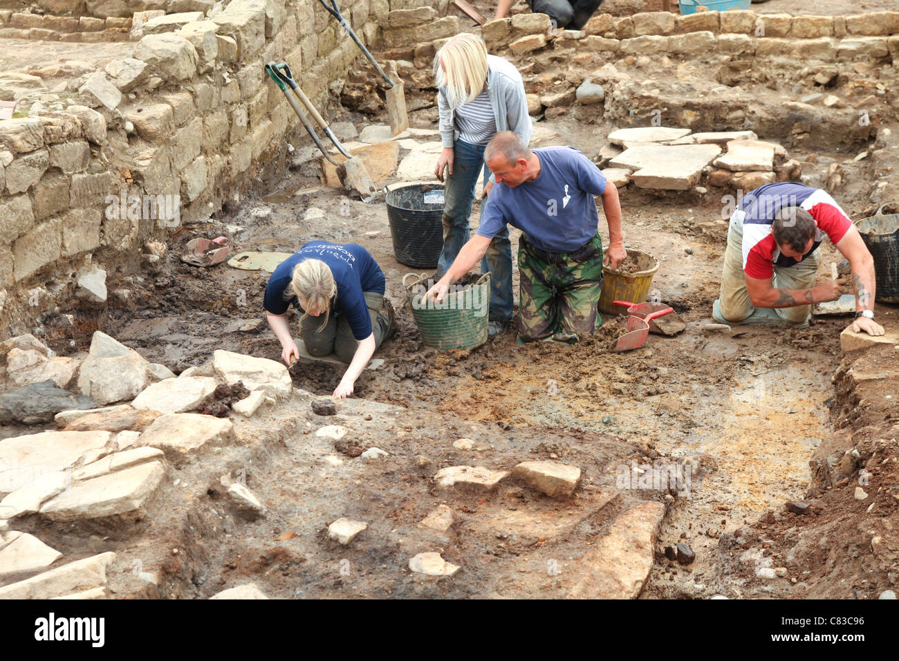Archaeologists digging at excavations at Roman Vindolanda Stock Photo ...