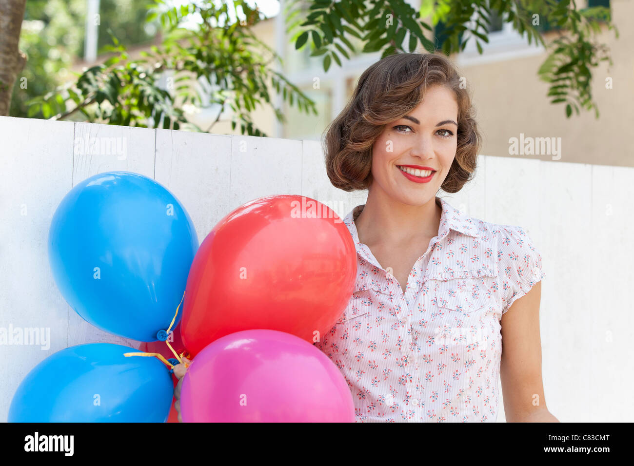 Woman Carrying Balloon High Resolution Stock Photography and Images - Alamy