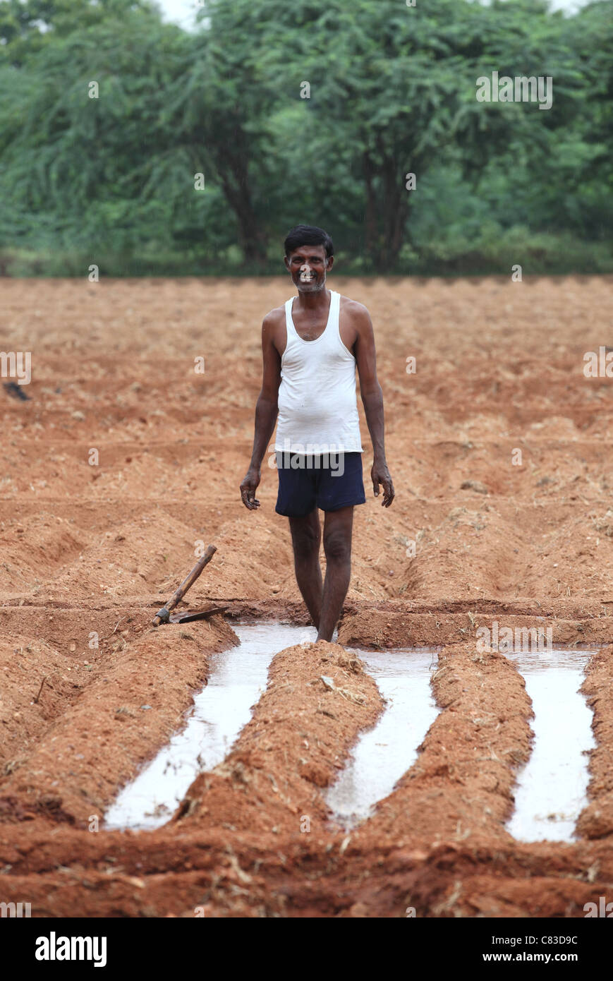 man working to open an irrigation channel Andhra Pradesh South India ...