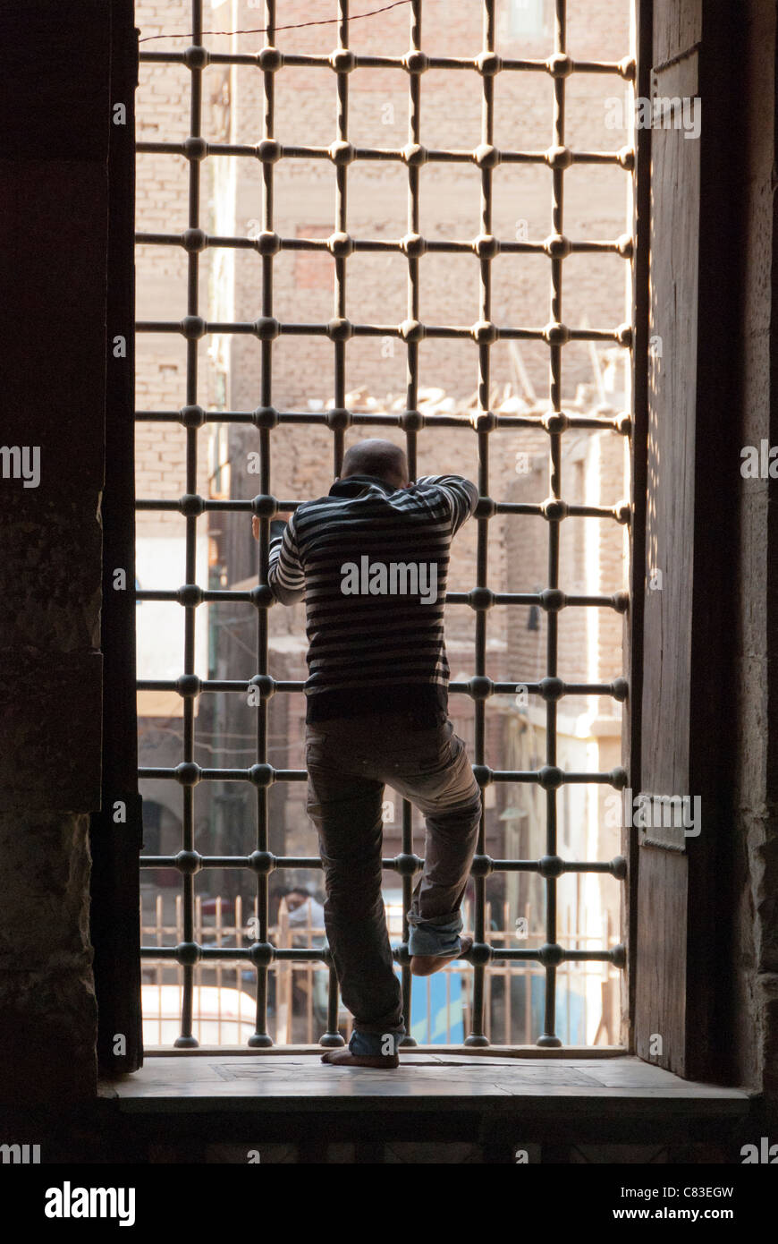Man looking outside the Qait Bey mosque - City of the Dead - Cairo ...