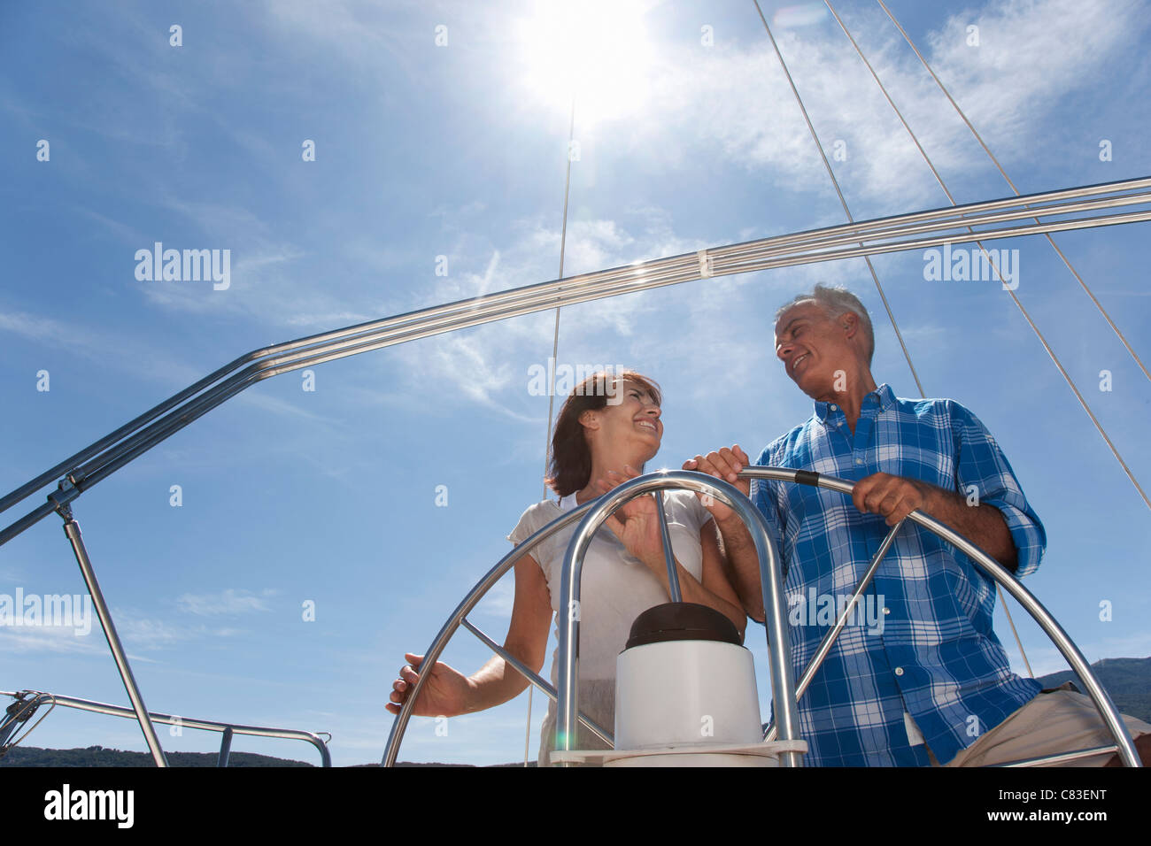 Older couple sailing together Stock Photo - Alamy