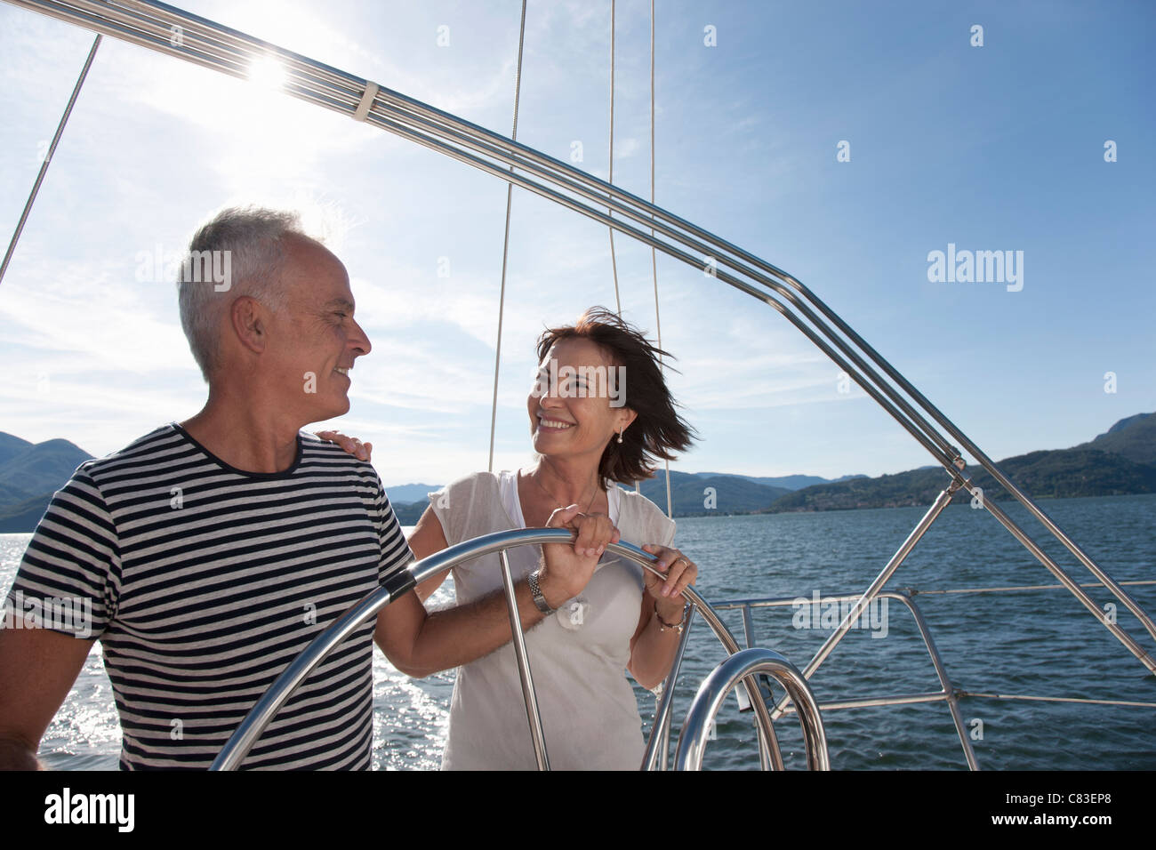 Older couple sailing together Stock Photo - Alamy