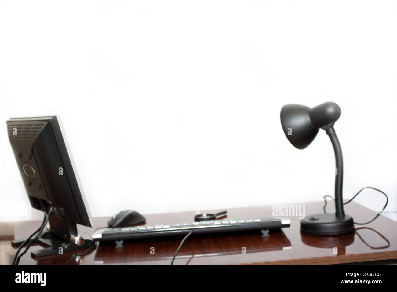 Computer monitor on office desk Stock Photo - Alamy