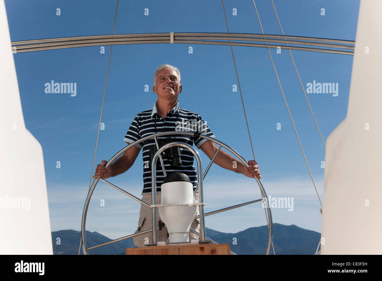 Person standing at front of sailing yacht hi-res stock photography and ...