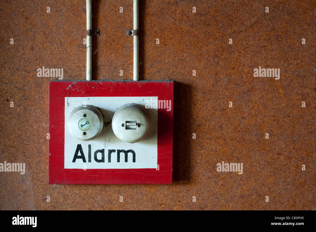 Red bordered alarm button with two switches Stock Photo - Alamy