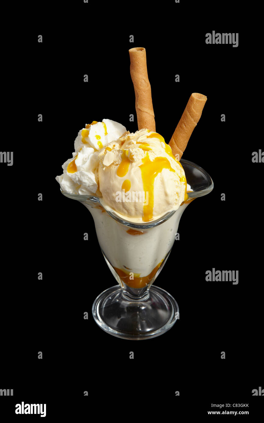 Ice Cream in Glass dish on a black background Stock Photo - Alamy