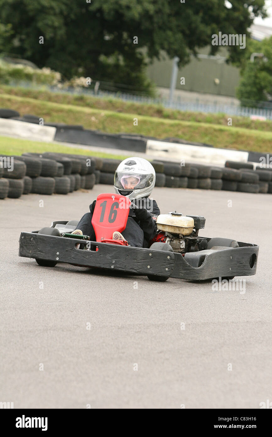 children racing go-carts on track Stock Photo - Alamy