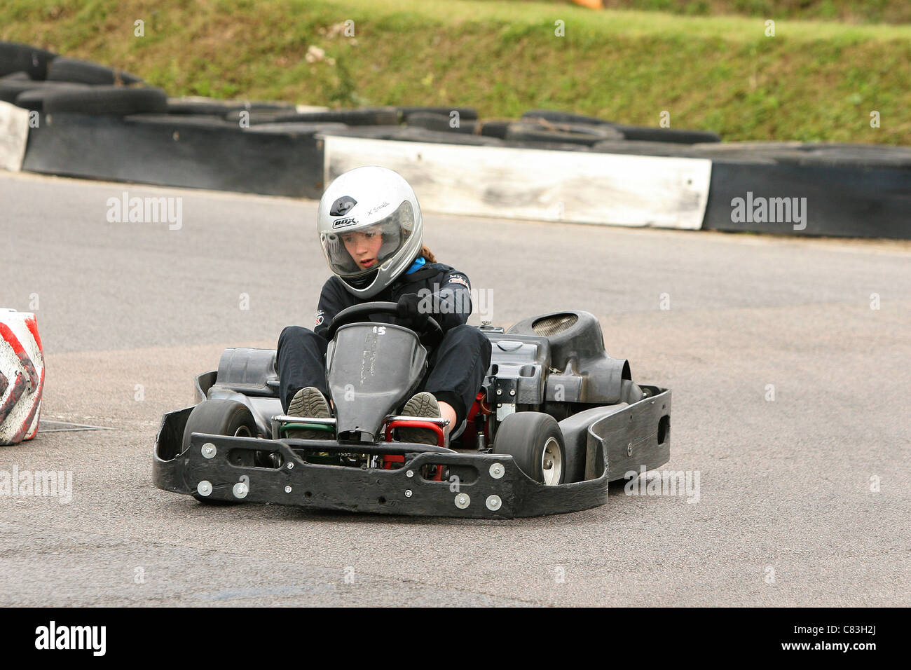 children racing go-carts on track Stock Photo - Alamy