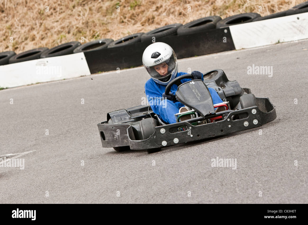 children racing go-carts on track Stock Photo - Alamy