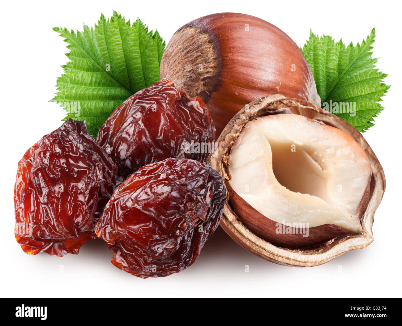 Filberts and the three raisins on a white background Stock Photo - Alamy