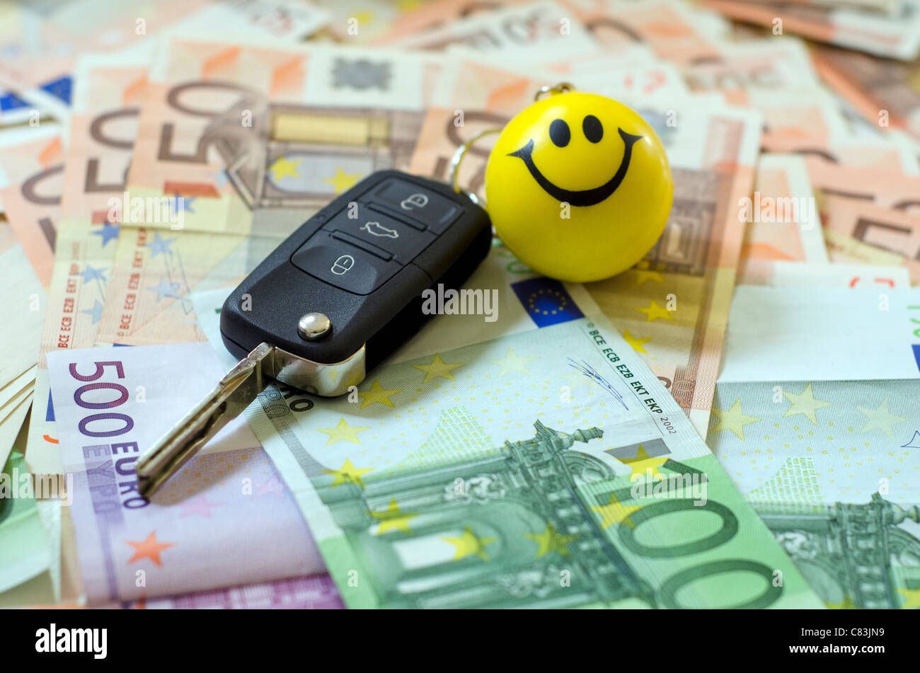 Car keys on European banknotes, symbol, investment Stock Photo - Alamy