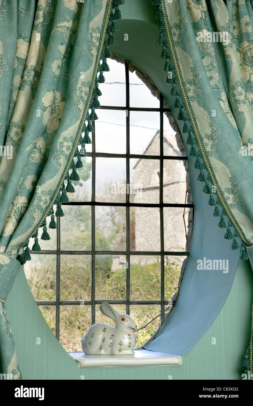 UK real estate. Old oval leaded light window Stock Photo - Alamy