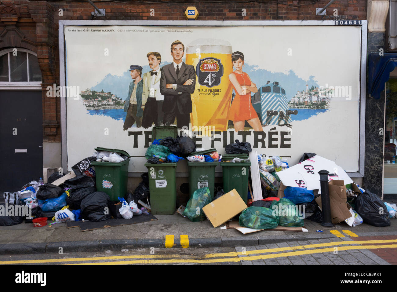Landscape in London street of street rubbish (garbage) left below a ...