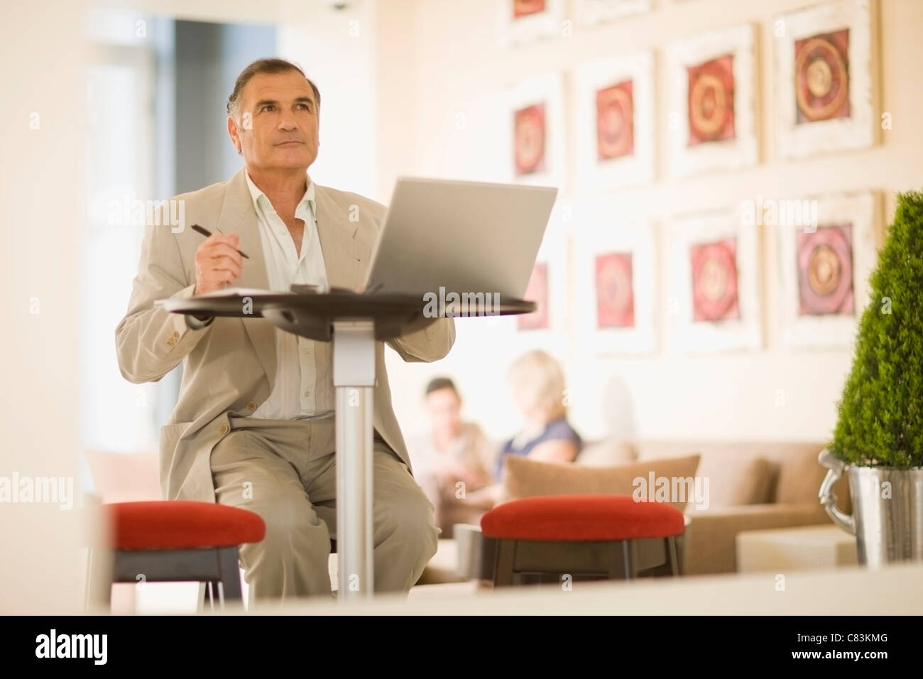 Businessman working on laptop Stock Photo - Alamy