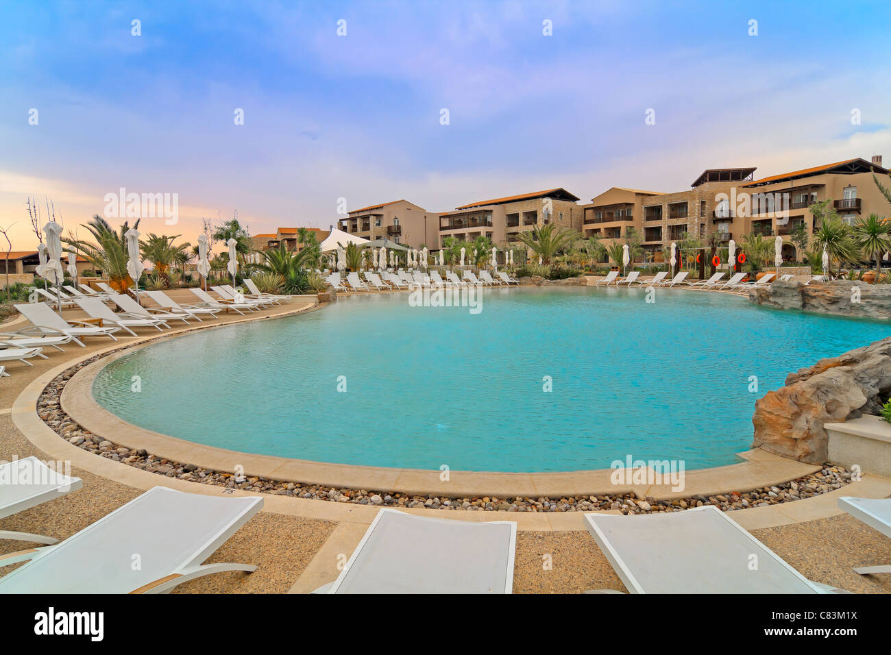 Luxury Resort Pool and chairs at hotel resort in Greece Stock Photo - Alamy