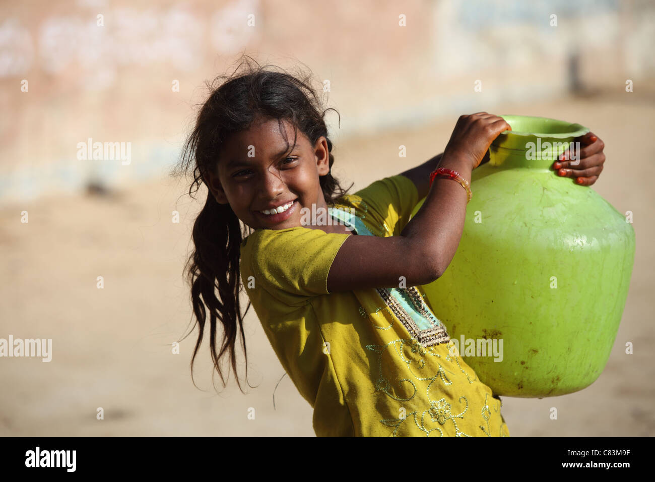 Indian carrying water pot child hi-res stock photography and images - Alamy