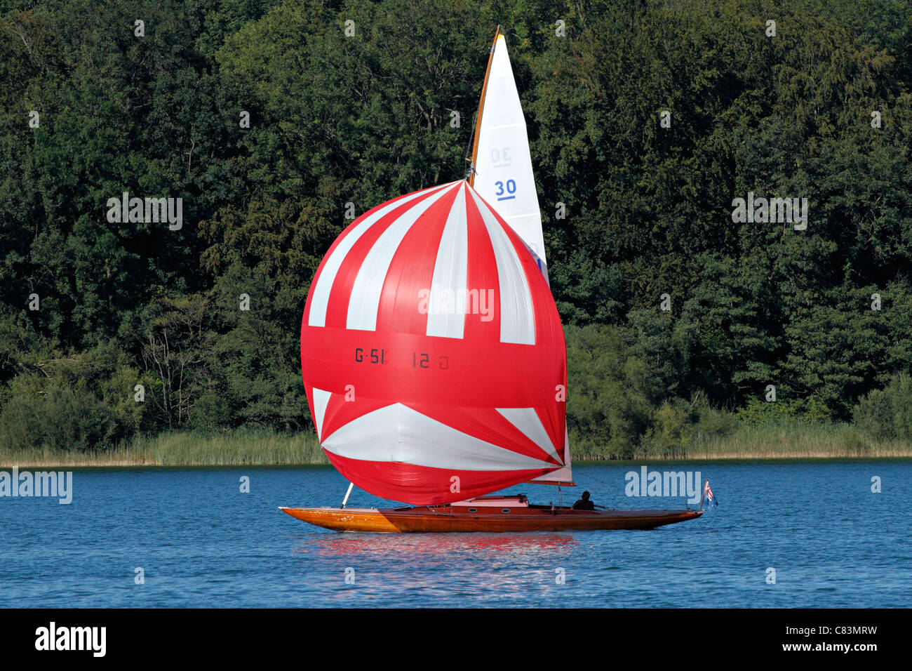 Sail Boat with red and white spinnaker on the Chiemsee, Chiemgau Upper ...