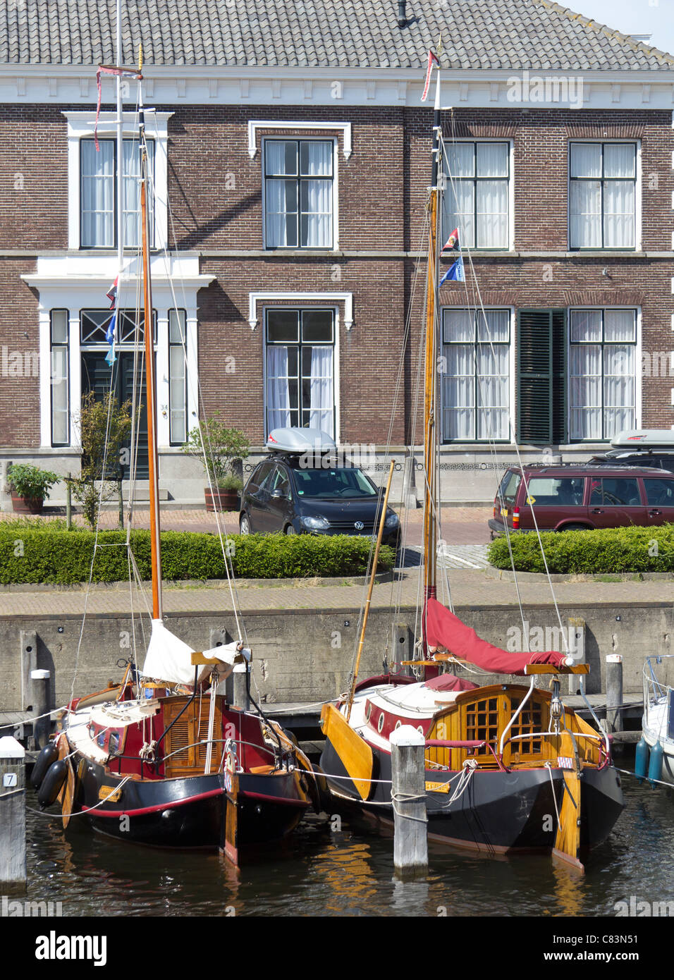 Traditional wooden Dutch sailing boats in the harbour at Brouwershaven ...