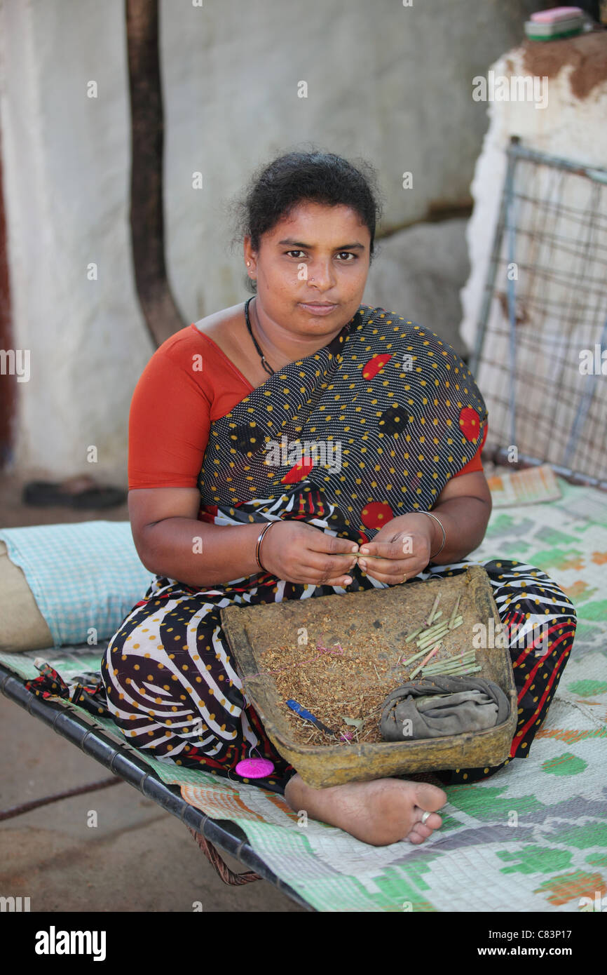Woman preparing a beedi , Indian cigarette Andhra Pradesh South India ...