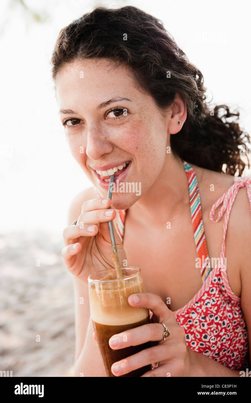 Woman sipping through straw hi-res stock photography and images - Alamy