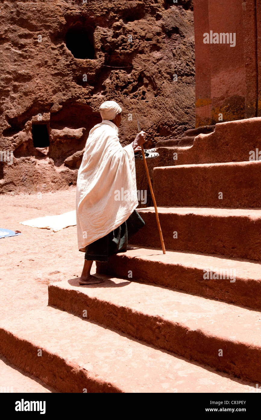 An Orthodox Christian pilgrim climbs the steps to the entrance of Bet ...