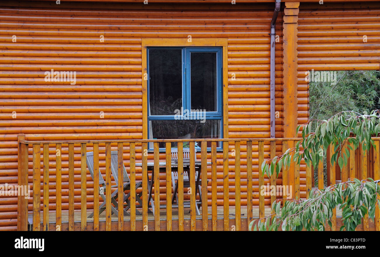 Log cabin terraces with window Stock Photo - Alamy