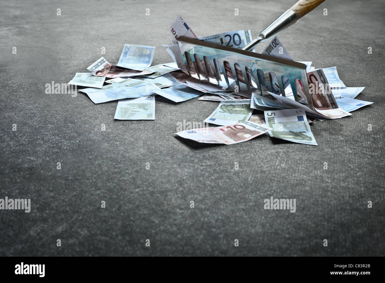 Rake money hi-res stock photography and images - Alamy