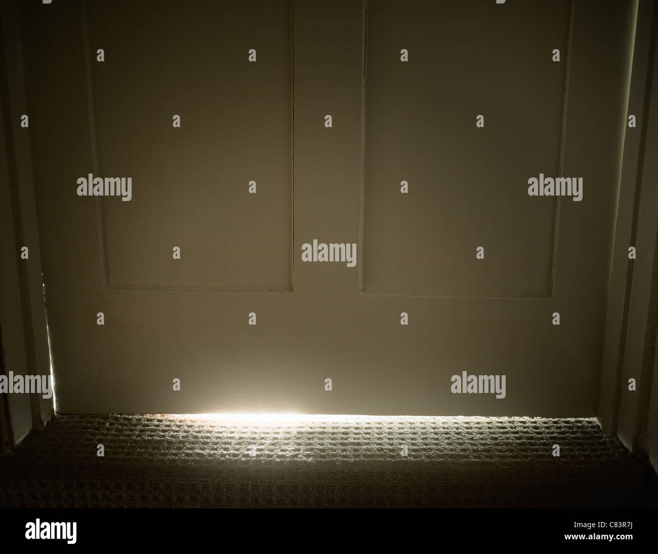 Light glowing from under door hi-res stock photography and images - Alamy
