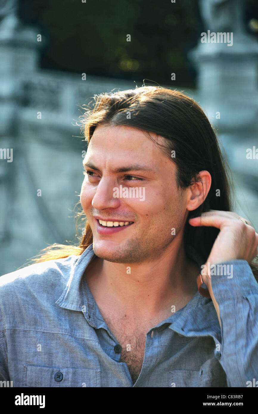 Man smiling outdoors Stock Photo - Alamy