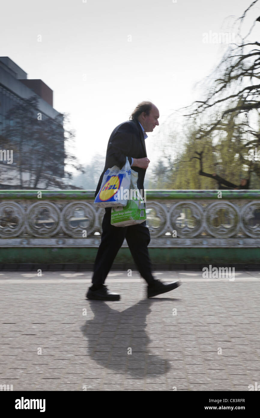 Man walking over a bridge hi-res stock photography and images - Alamy