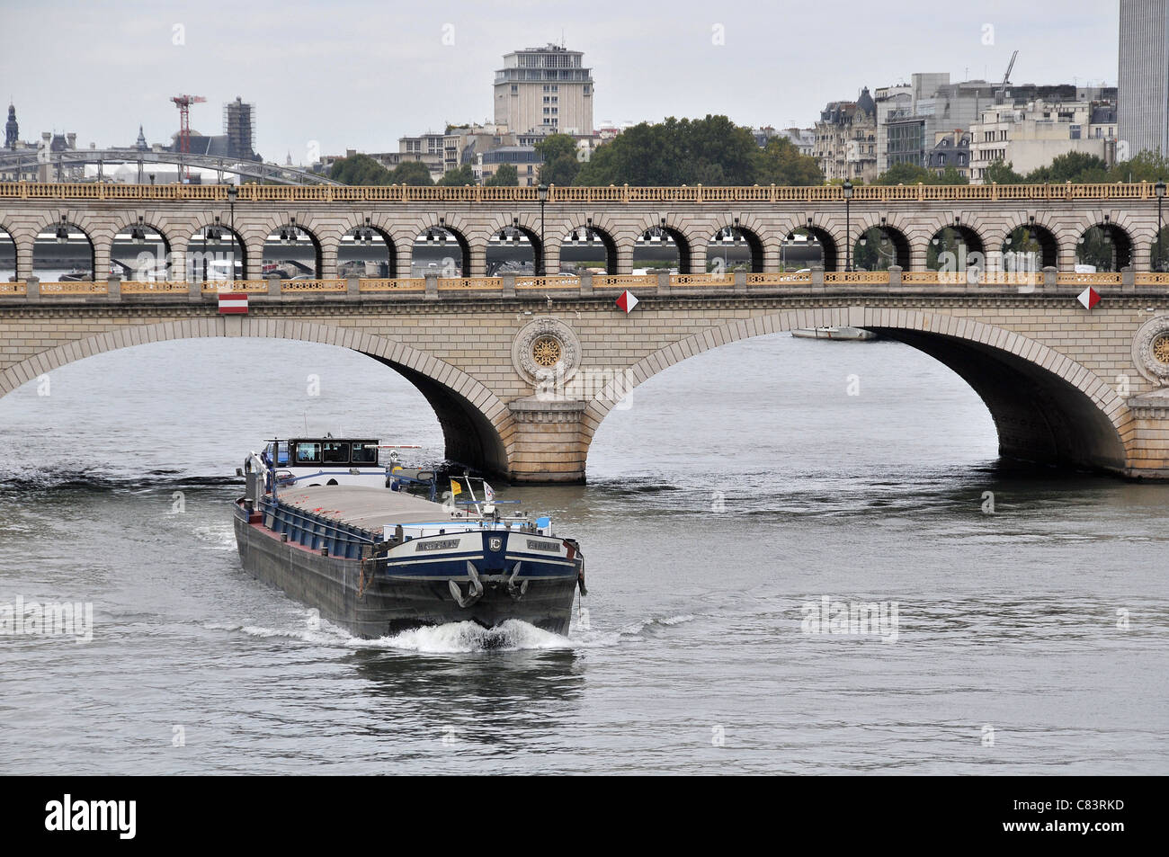 barge sailing on Seine river under Bercy bridge Paris France Stock ...