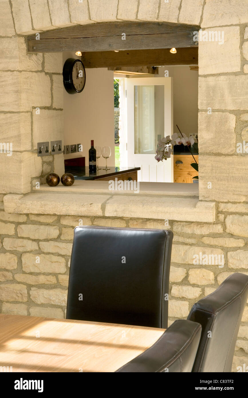 Dining room serving hatch room feature in an exposed stone wall Stock ...