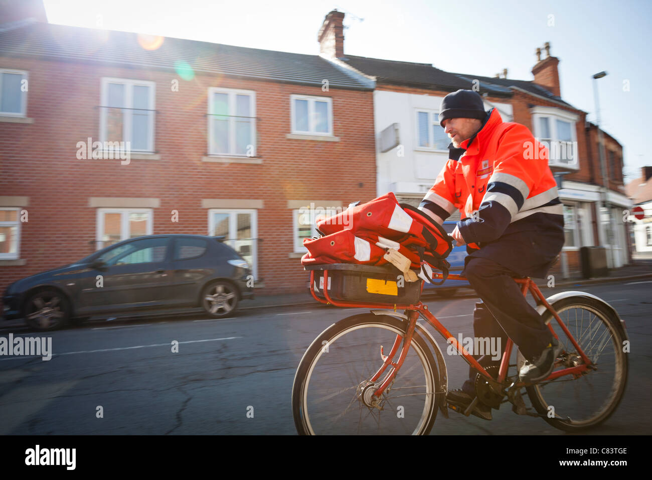 Postman on bicycle hi-res stock photography and images - Alamy