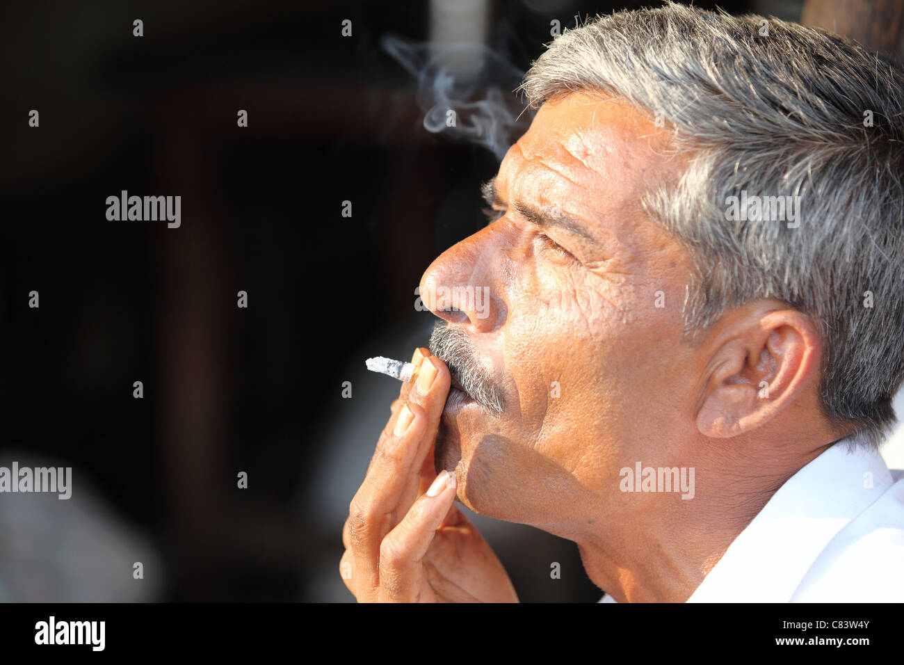 Indian man smoking a cigarette Andhra Pradesh South India Stock Photo ...