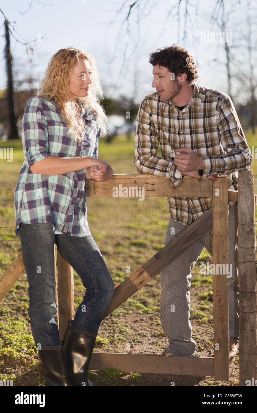 Man woman talking fence hi-res stock photography and images - Alamy