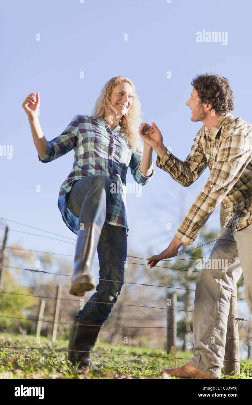 Climbing over fence hi-res stock photography and images - Alamy