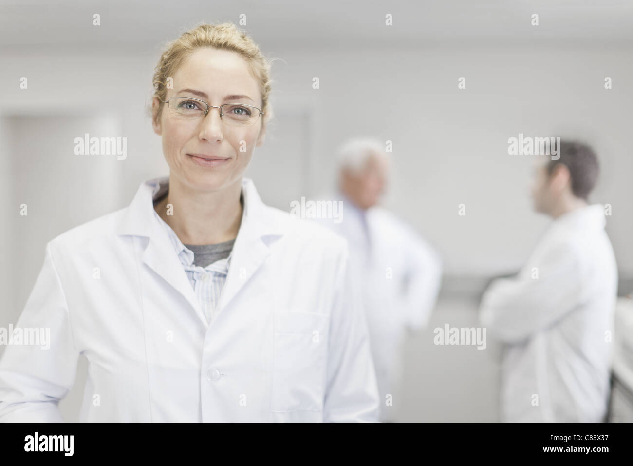 Scientist smiling in pathology lab Stock Photo - Alamy