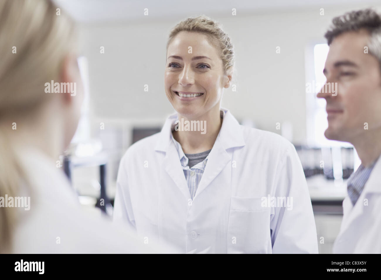Scientist smiling in pathology lab Stock Photo - Alamy